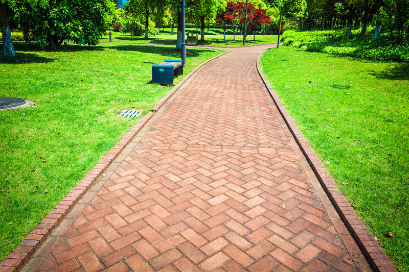 Designing Inviting Pathways with Custom Walkway Installation
